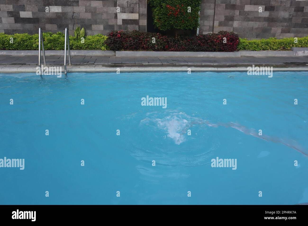 Swimming pool water surface on background and sunshine texture ...