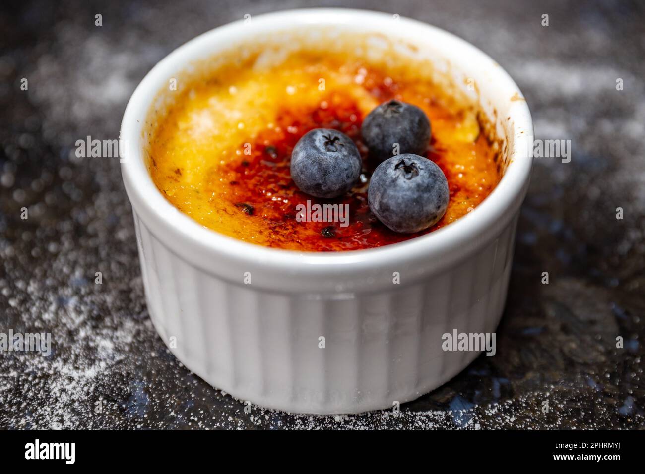 Traditional creme brulee on rustic surface and selective focus Stock ...