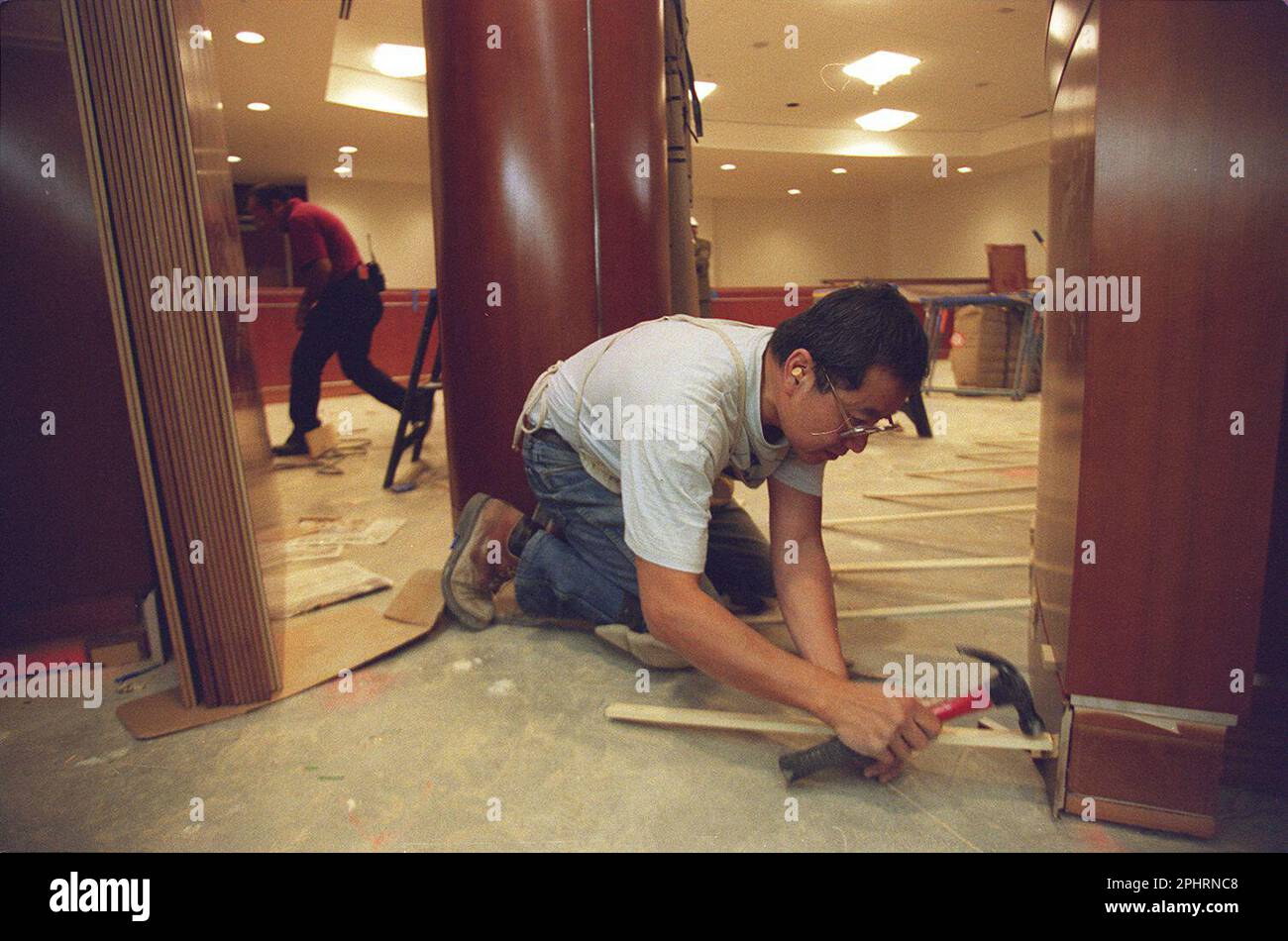 COURTHOUSE 1/C/07OCT97/CD/LS ------ Kwee Ong works on the base board of ...