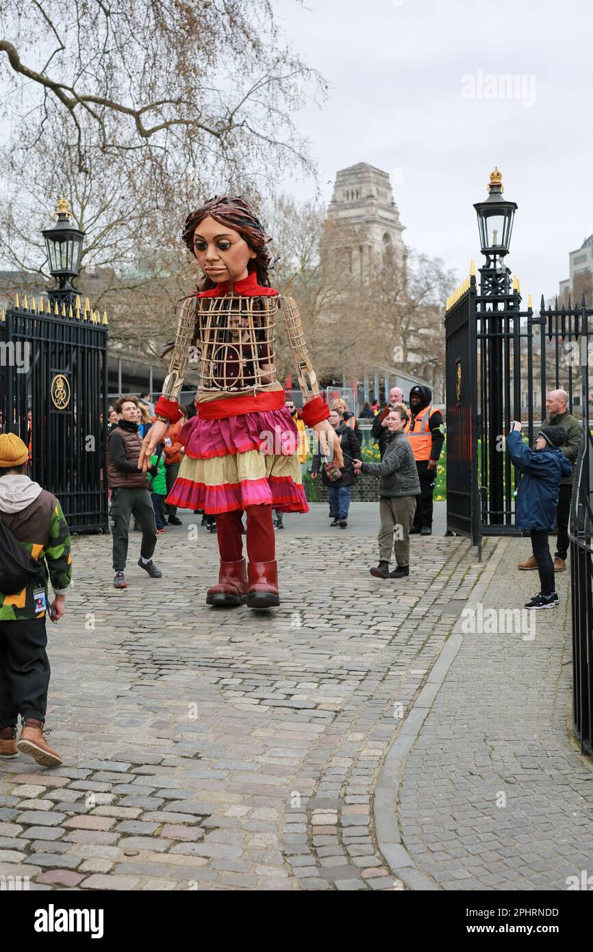 London, UK. 29 March 2023. Giant puppet Little Amal walks around the ...