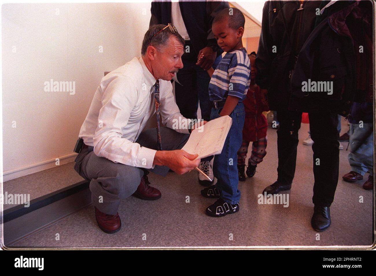 SCHOOLS 5/C/28AUG96/CD/LS Principal Ken Romines sits in the corridor of ...