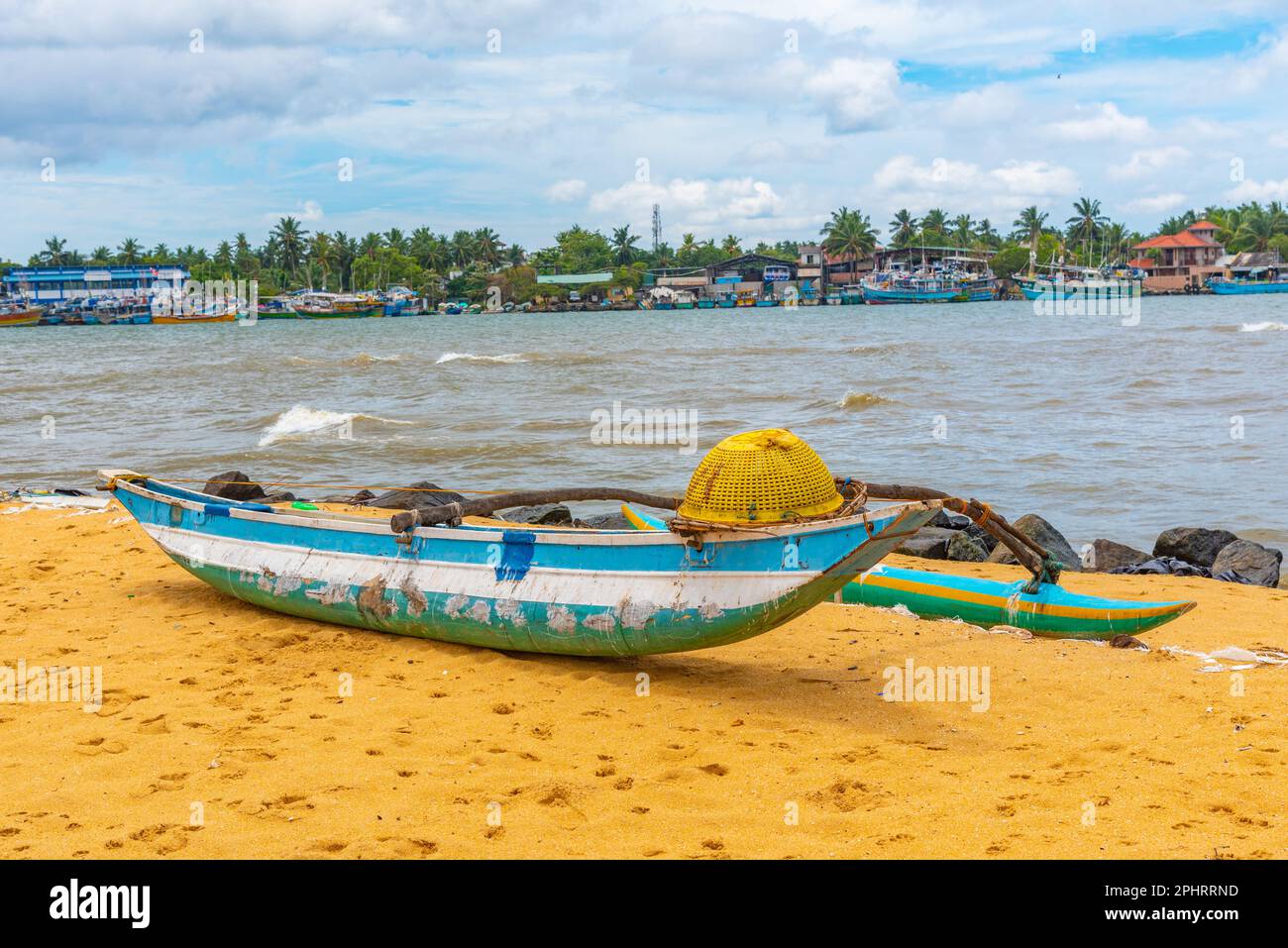 Fishing boats mooring at the shore of Negombo lagoon in Sri Lanka Stock ...