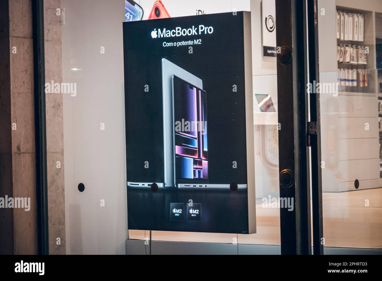 Apple store with photo of an iPhone in the background Stock Photo - Alamy