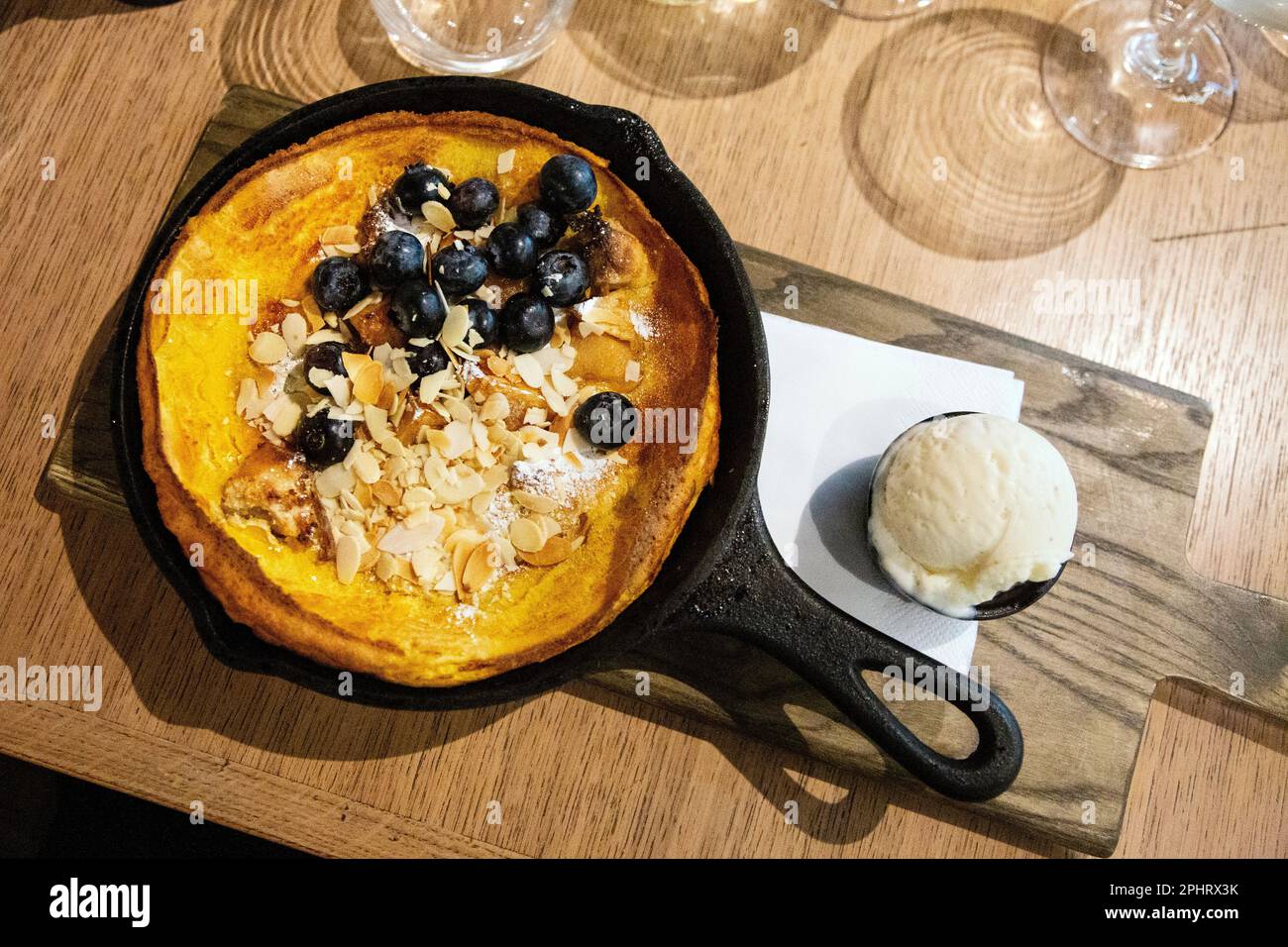 Dutch baby pancake with apple, flaked almonds and blueberries at Where ...