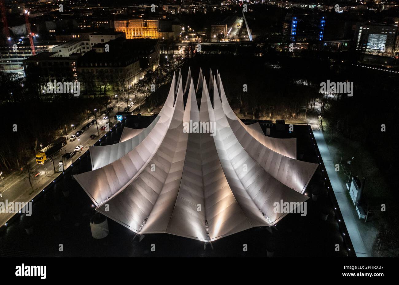Berlin, Germany. 30th Mar, 2023. The roof of the Tempodrom lights up in ...