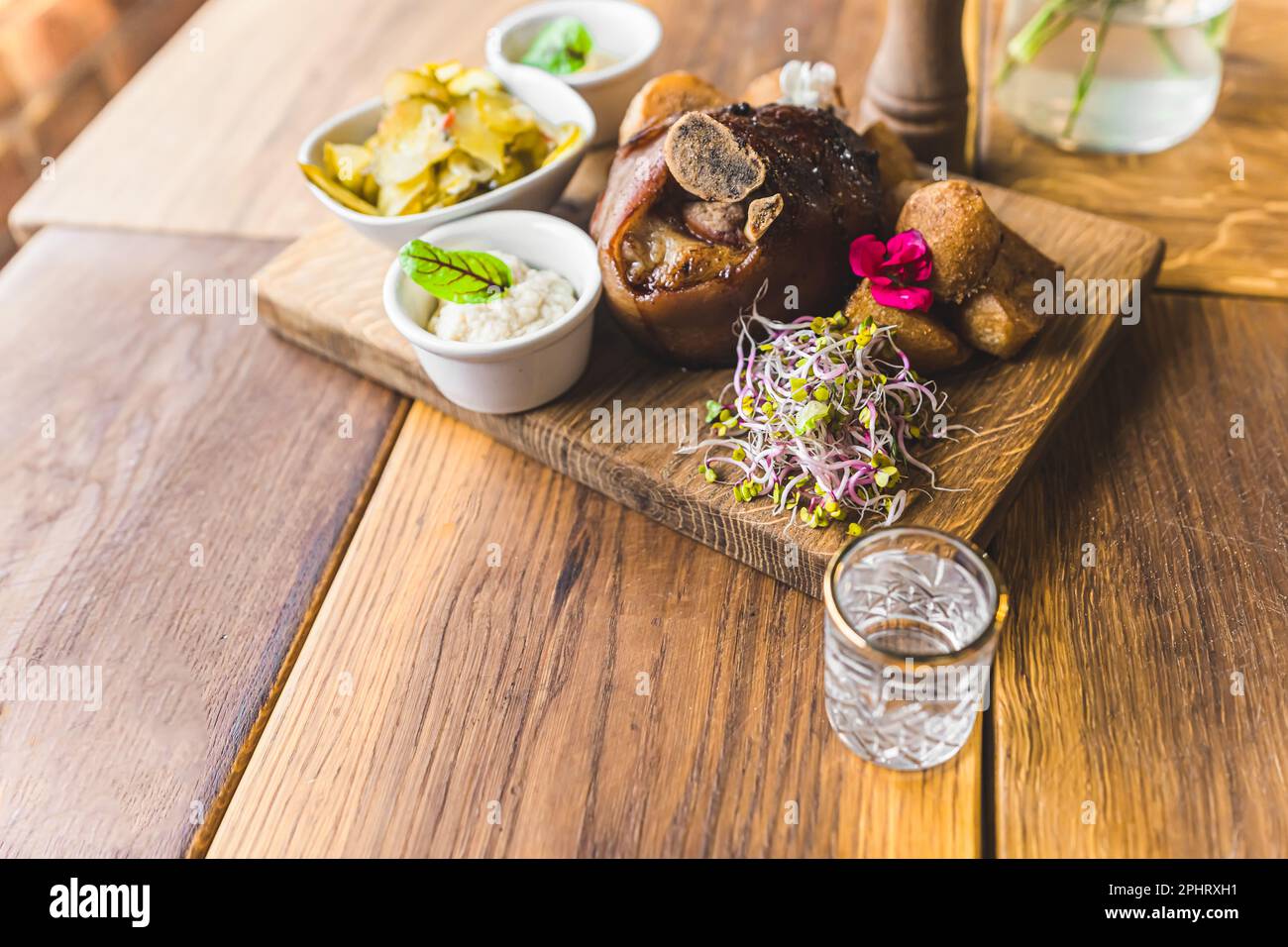 Oven baked pork knuckle - Polish Cuisine with a glass of vodka. High ...