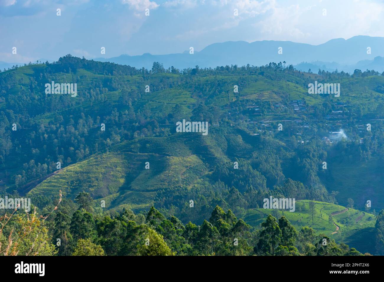Hilly landscape of Sri Lanka dotted with villages and tea plantations ...