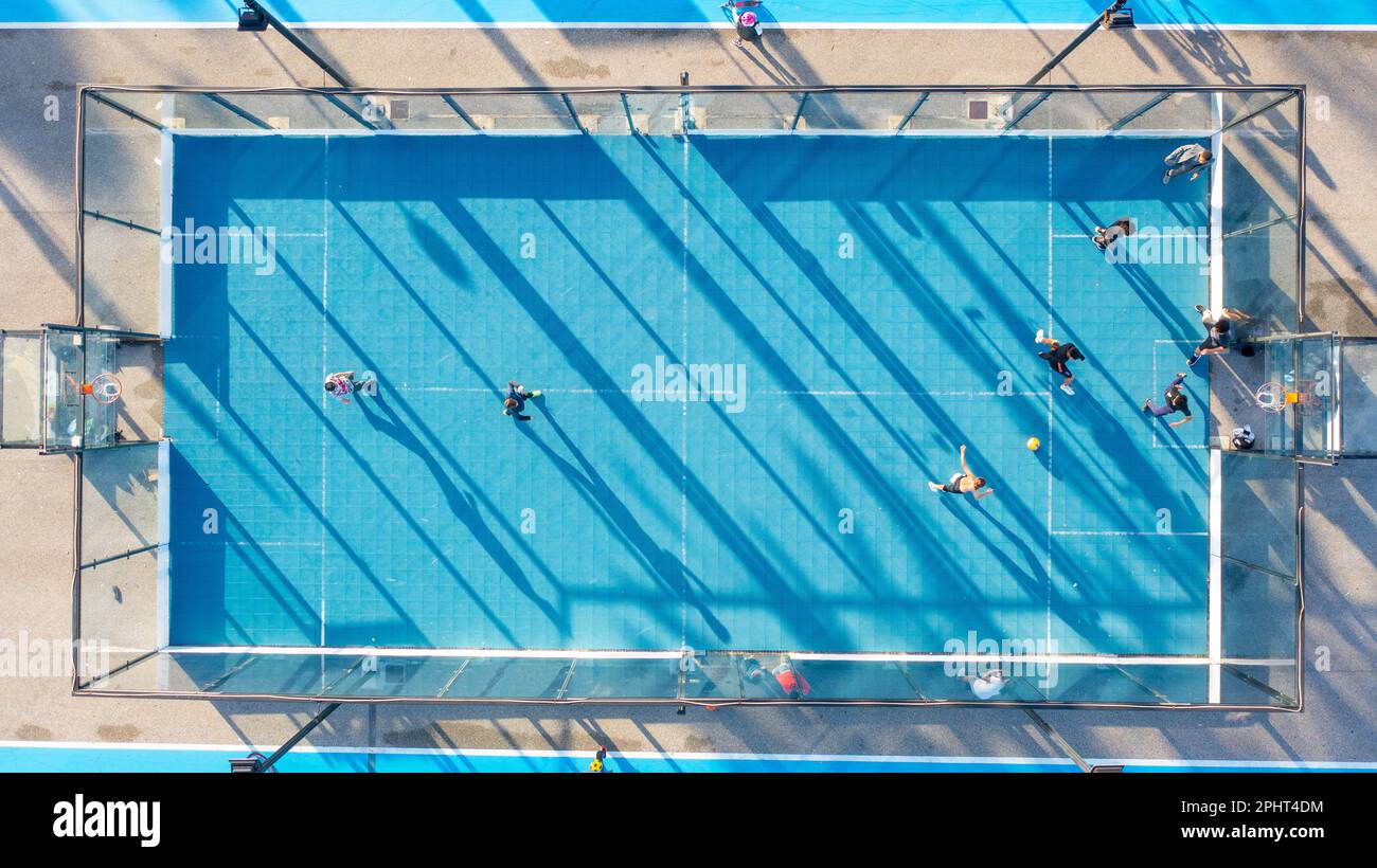 Aerial view of the city public basketball and football court. Universal ...