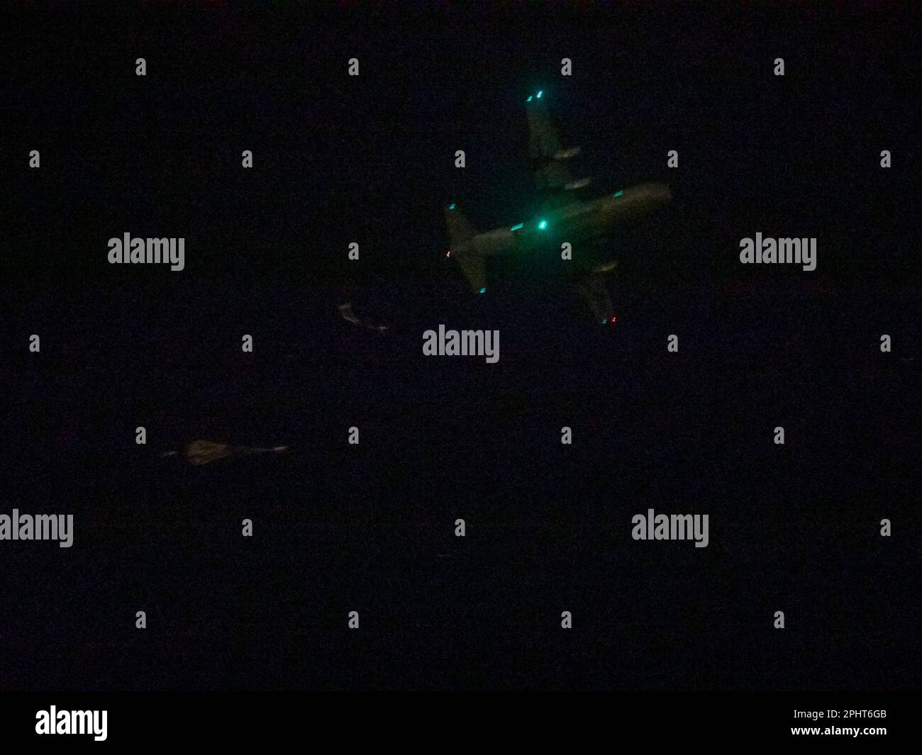 Pilots flying a C-130J over Ladd Army Airfield deliver paratroopers ...