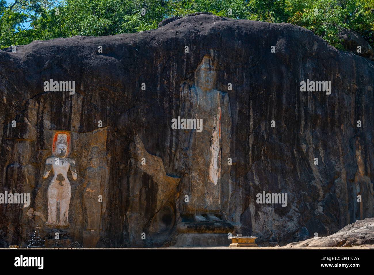 Buddha statues carved into stone at buduruwagala ancient site at Sri ...