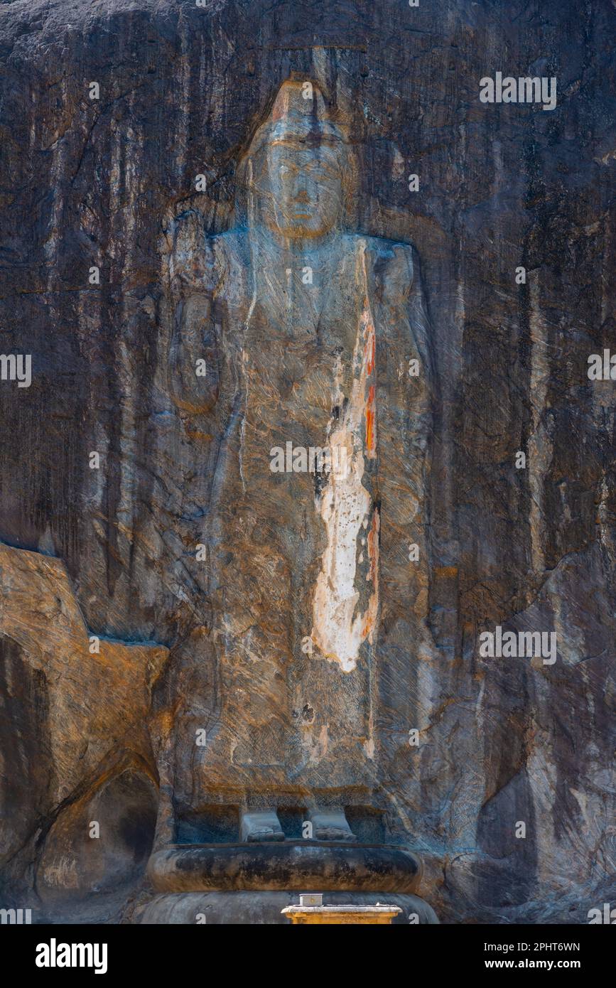 Buddha statues carved into stone at buduruwagala ancient site at Sri ...