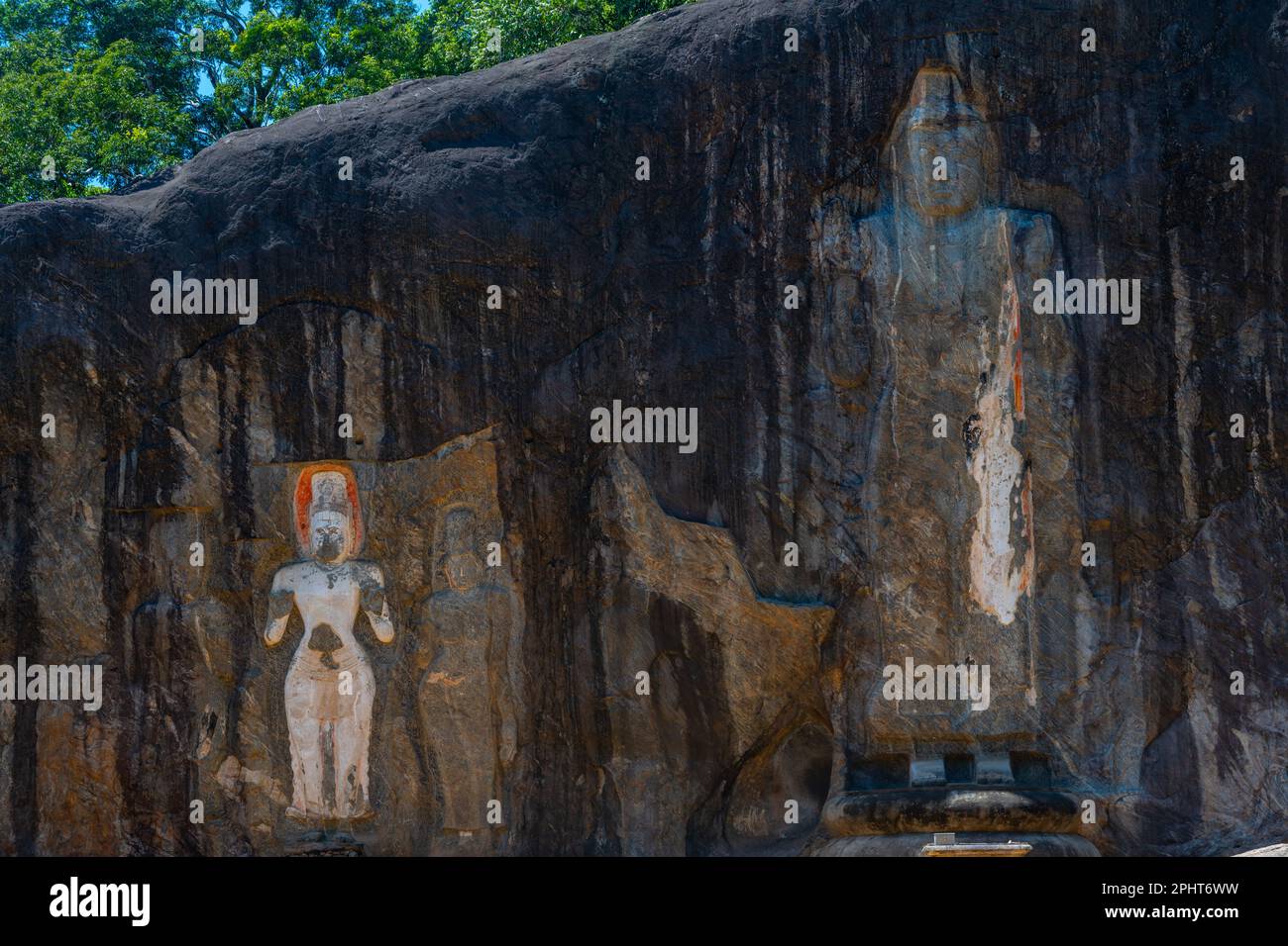 Buddha statues carved into stone at buduruwagala ancient site at Sri ...