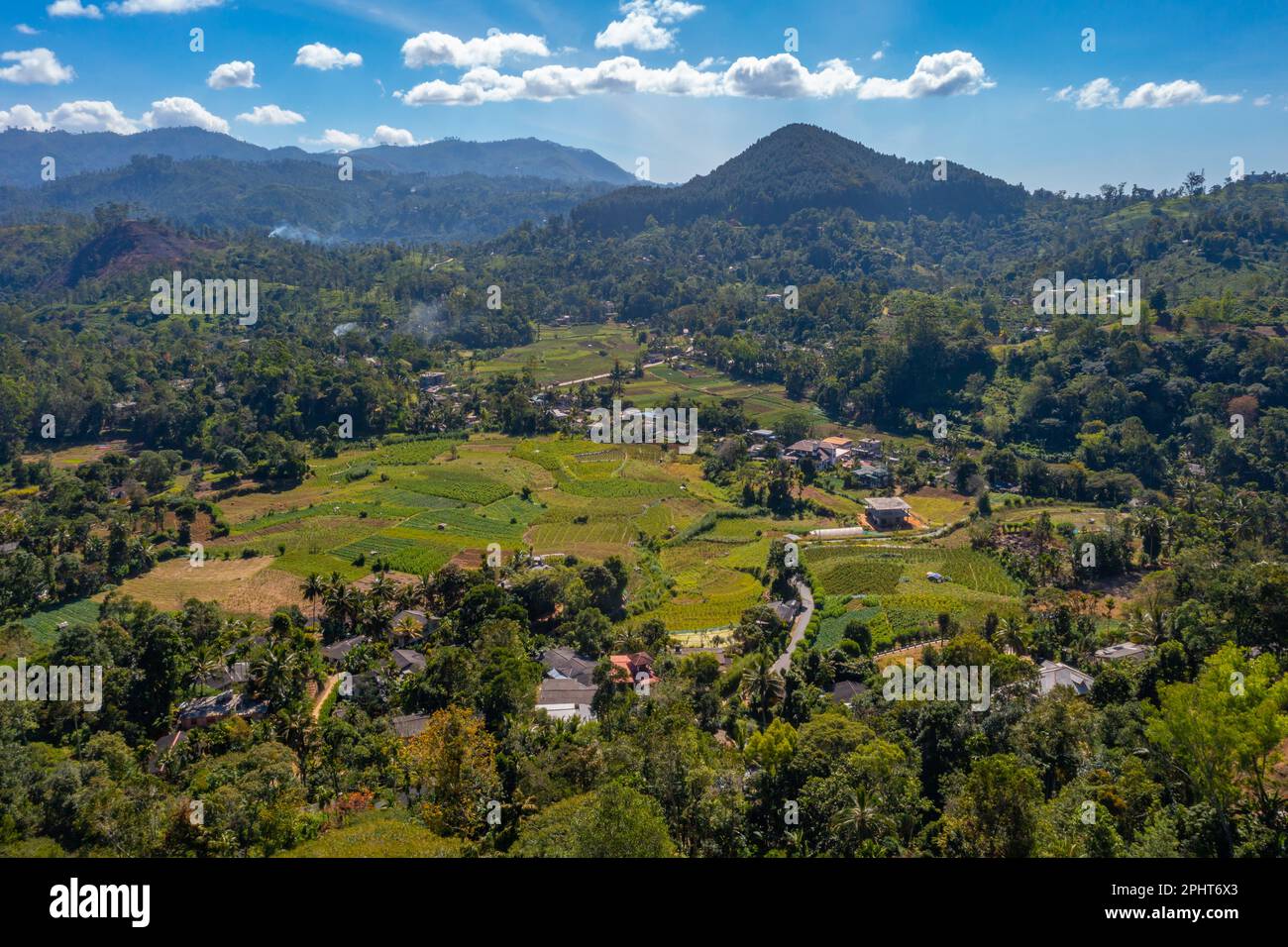 Hilly landscape of Sri Lanka dotted with villages and tea plantations ...