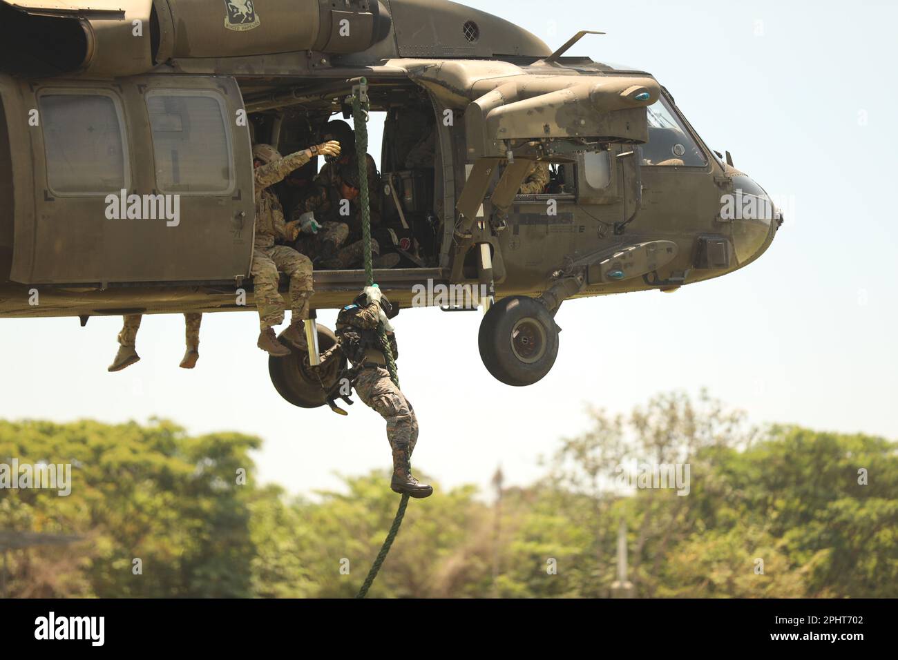 Guatemalan Naval Special Forces fast rope from a UH60 Blackhawk for ...