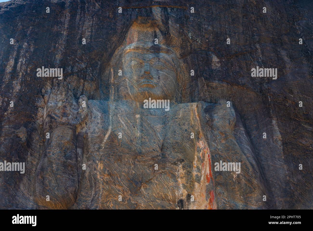 Buddha statues carved into stone at buduruwagala ancient site at Sri ...
