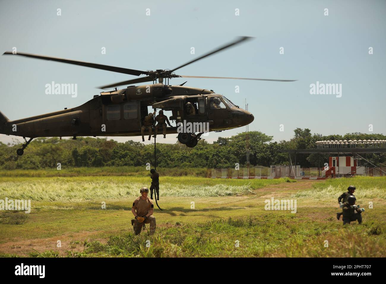 Guatemalan Naval Special Forces fast rope from a UH60 Blackhawk for ...