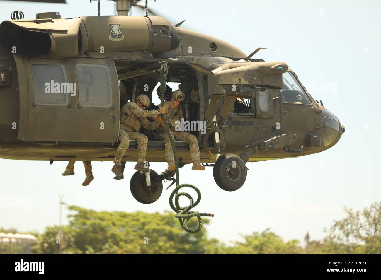 Navy SEALs drop fast rope from a UH60 Blackhawk with 1-228th Aviation ...