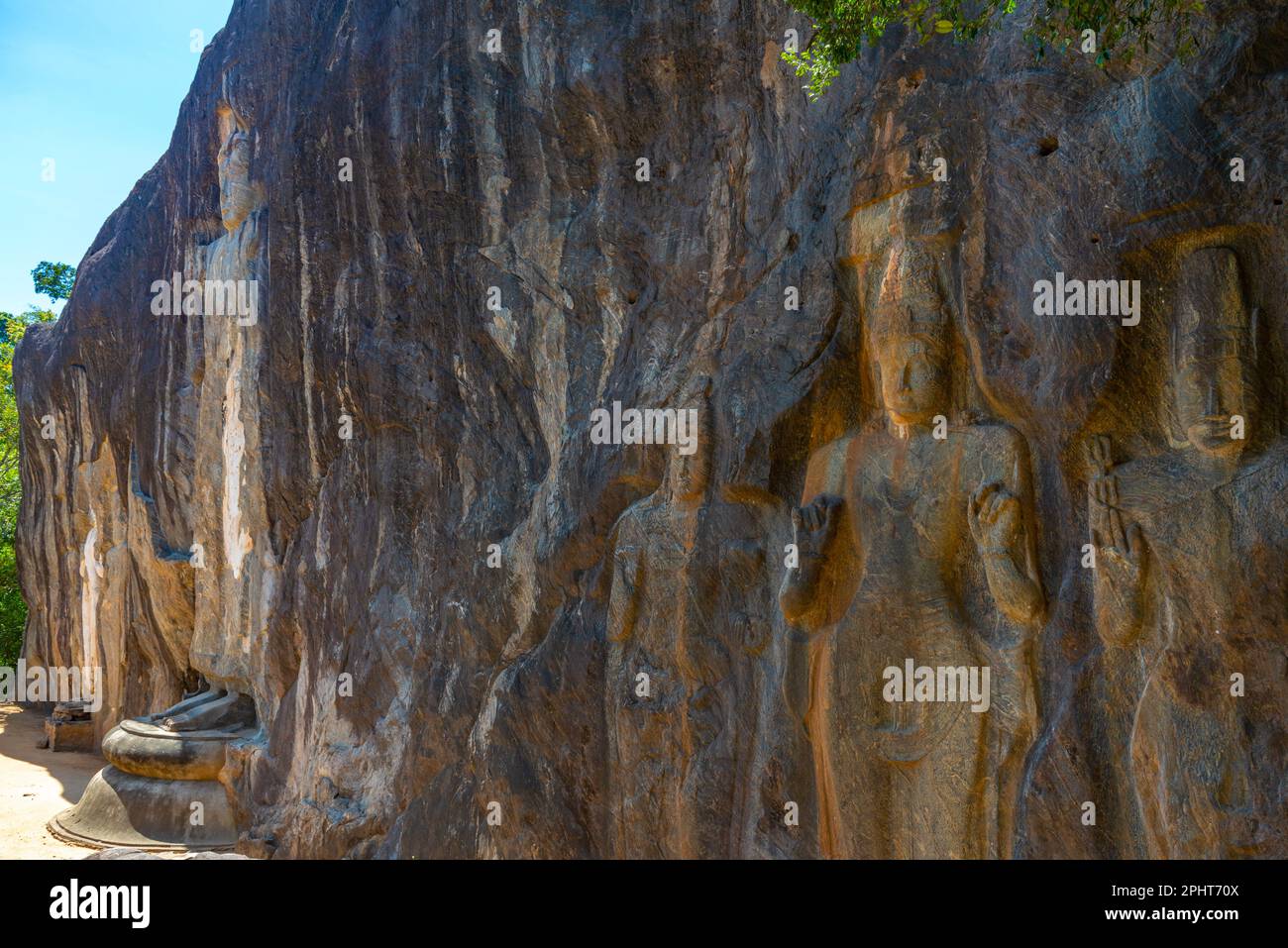 Buddha statues carved into stone at buduruwagala ancient site at Sri ...