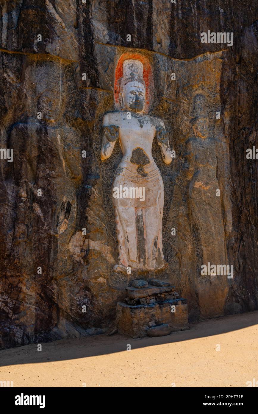 Buddha statues carved into stone at buduruwagala ancient site at Sri ...