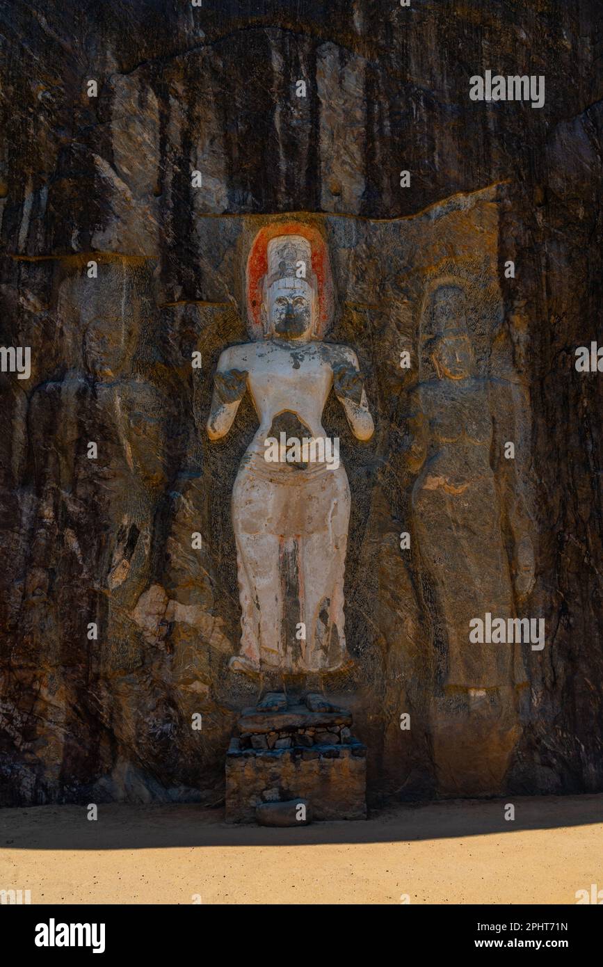 Buddha statues carved into stone at buduruwagala ancient site at Sri ...