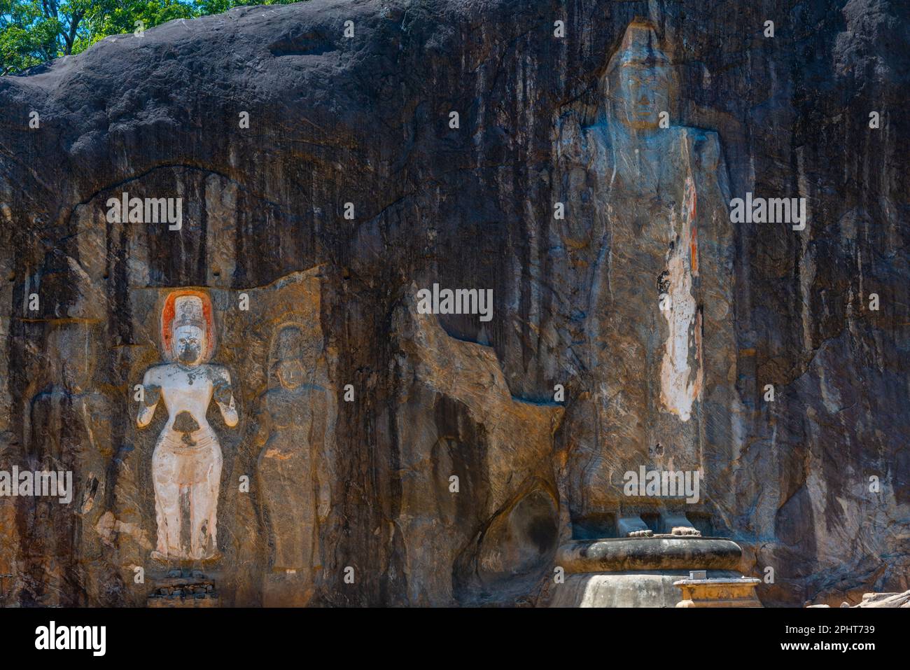 Buddha statues carved into stone at buduruwagala ancient site at Sri ...