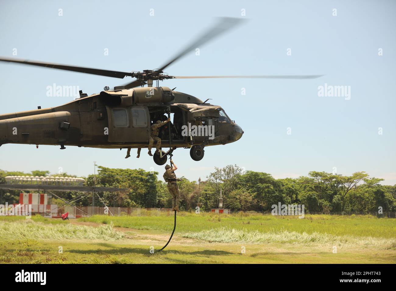 Guatemalan Naval Special Forces fast rope from a UH60 Blackhawk for ...