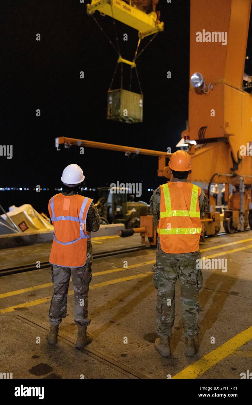 U.S. Soldiers observe unloading of equipment from U.S. Army Vessel ...