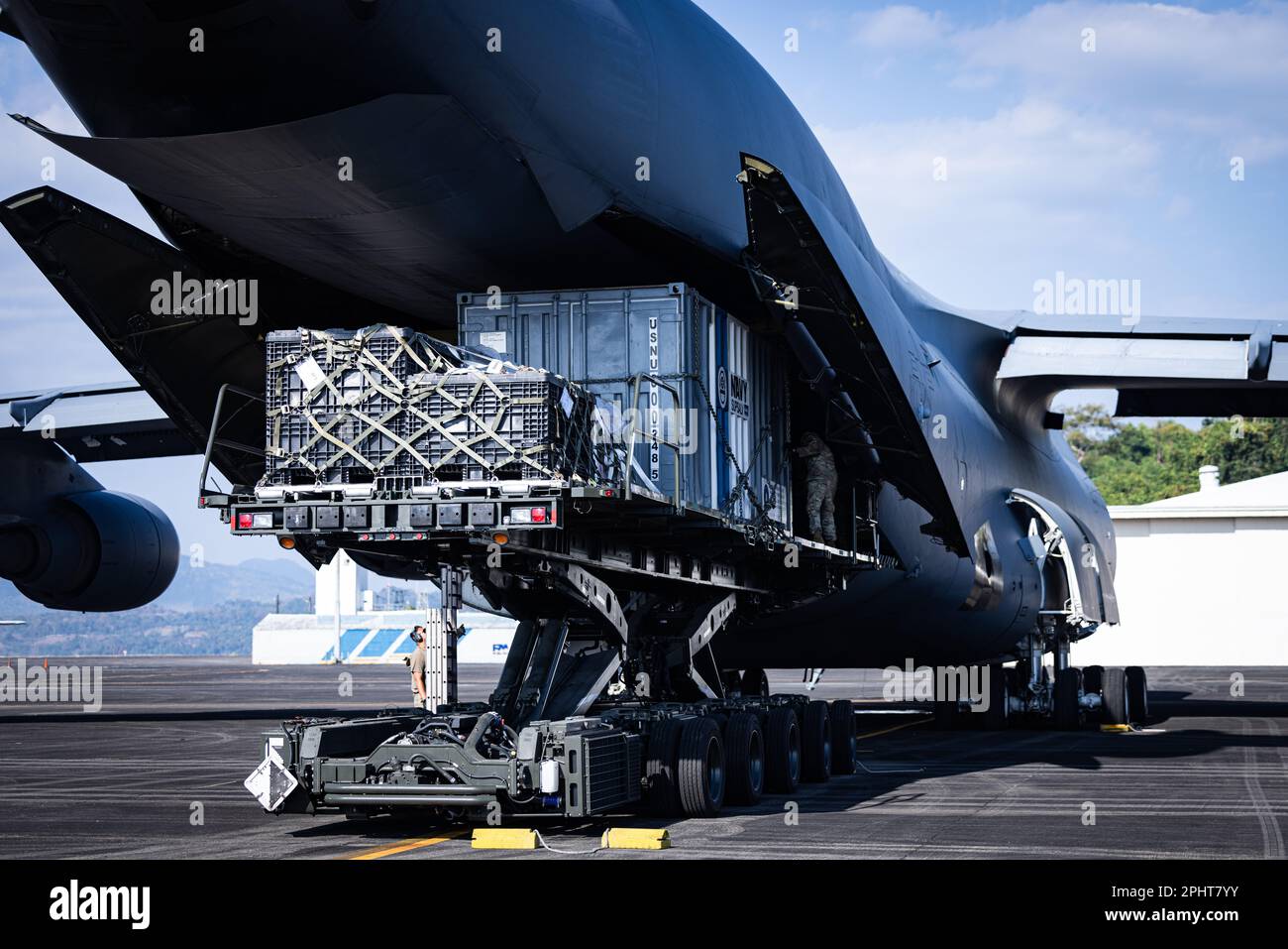 U.S. Air Force Airmen with 735th Air Mobility Squadron offload ...