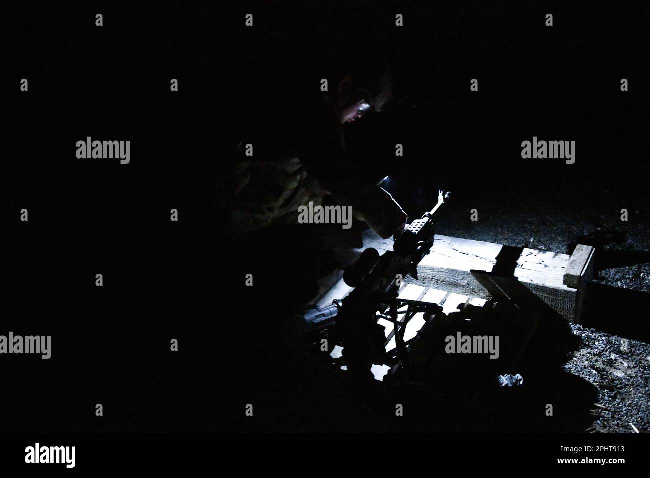 A U.S. Soldier assigned to 4th Squadron, 2nd Cavalry Regiment zeros an ...