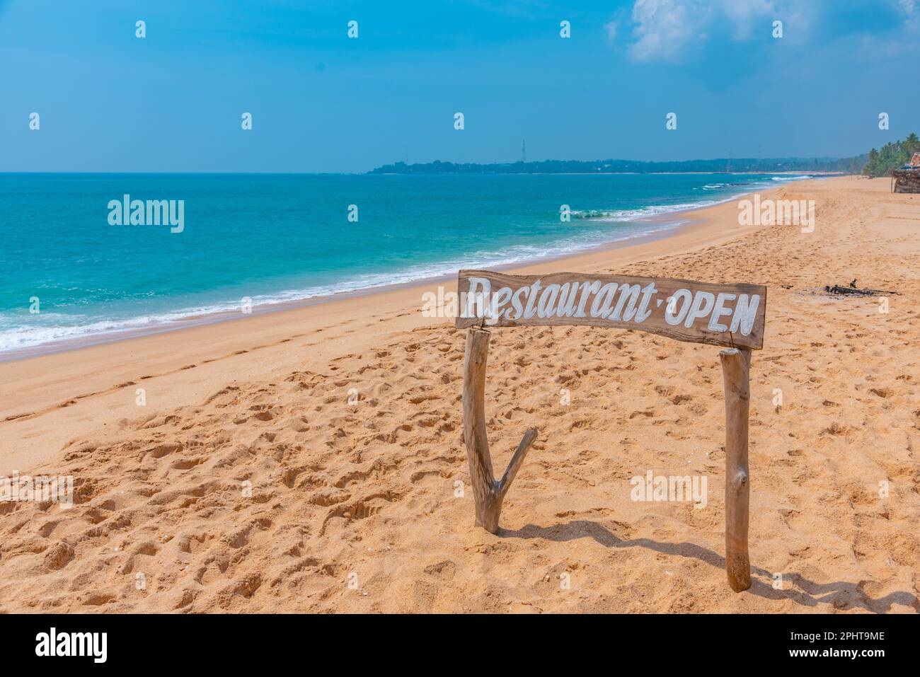 Sign restaurant - open on a beach Stock Photo - Alamy