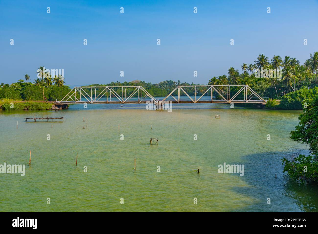 Train crossing Koggala lagoon on a bridge, Sri Lanka Stock Photo - Alamy