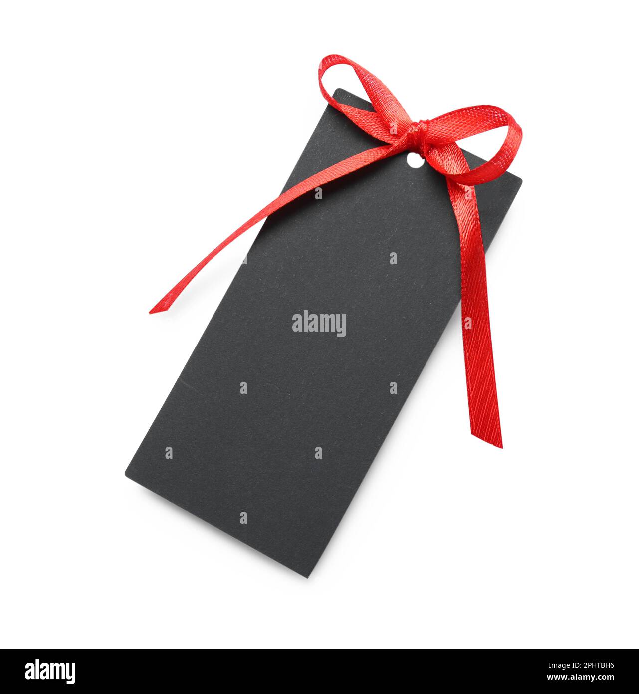 Blank black gift tag with red satin ribbon on white background, top ...