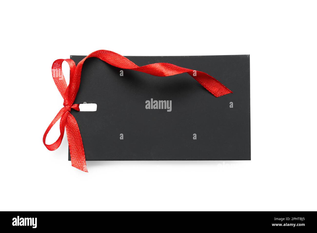 Blank black gift tag with red satin ribbon on white background, top ...