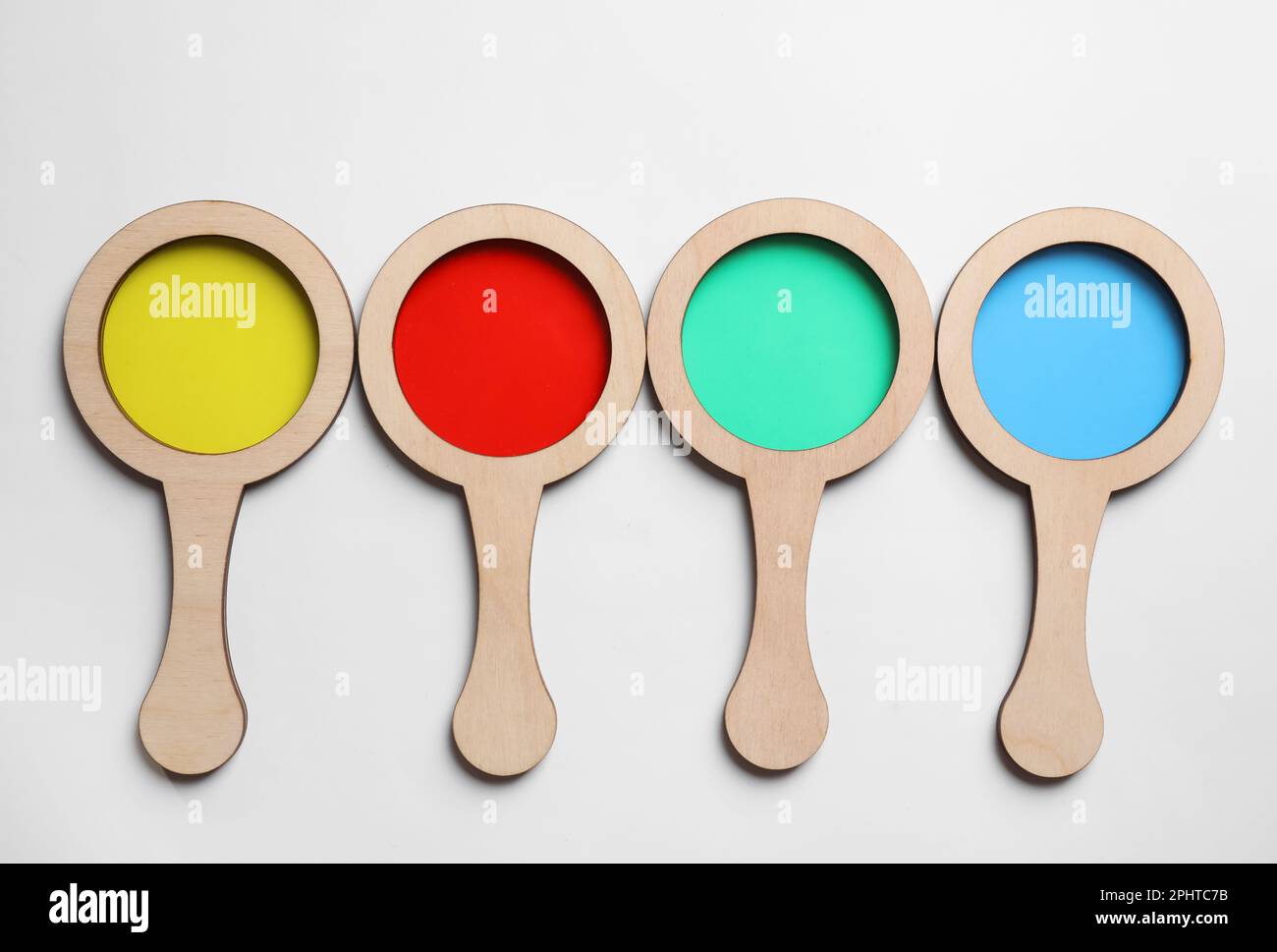 Set of colorful magnifiers on white background, top view. Montessori ...