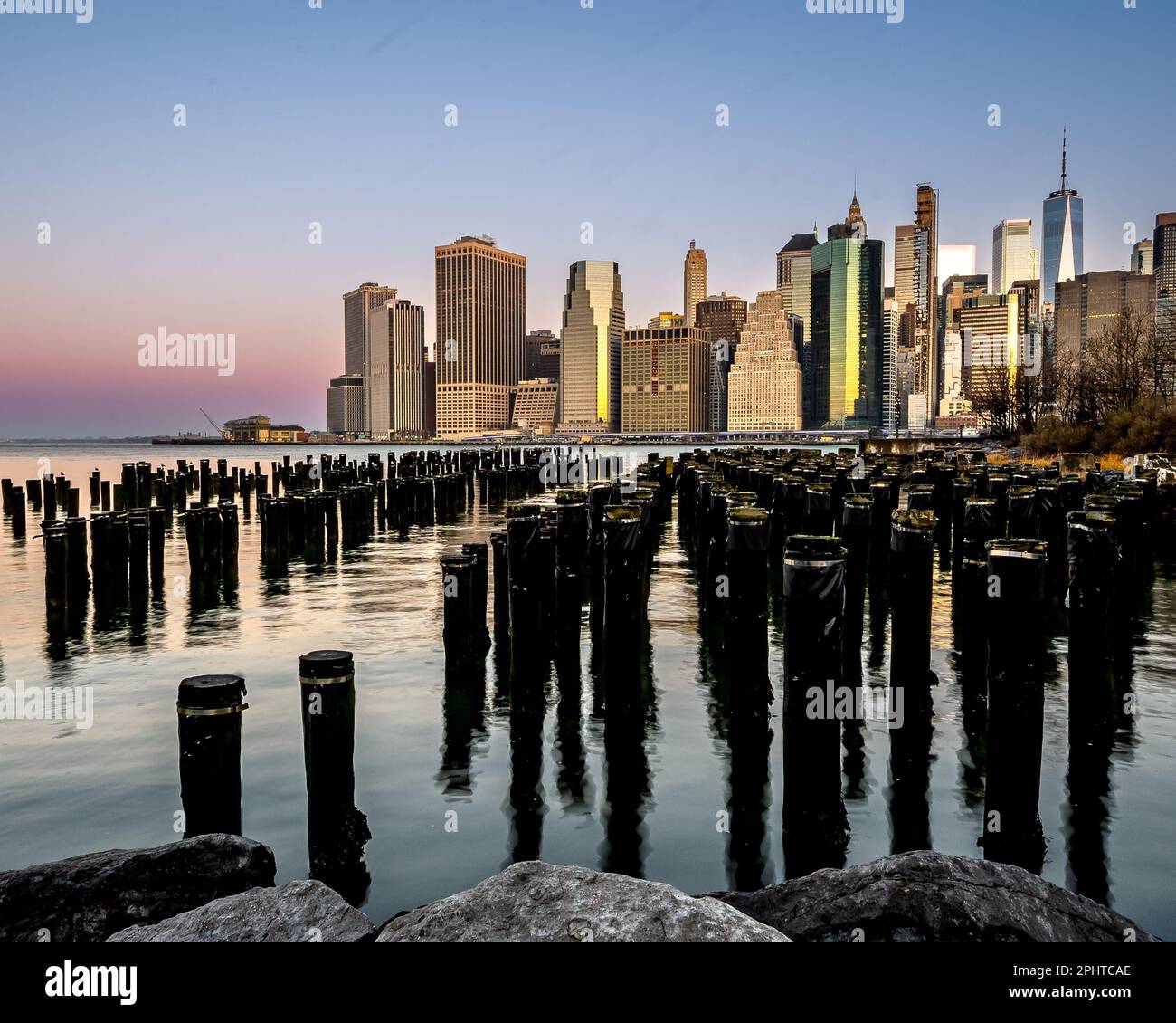 Brooklyn, NY - USA - March 26, 2023 View of the timber pilings of the ...