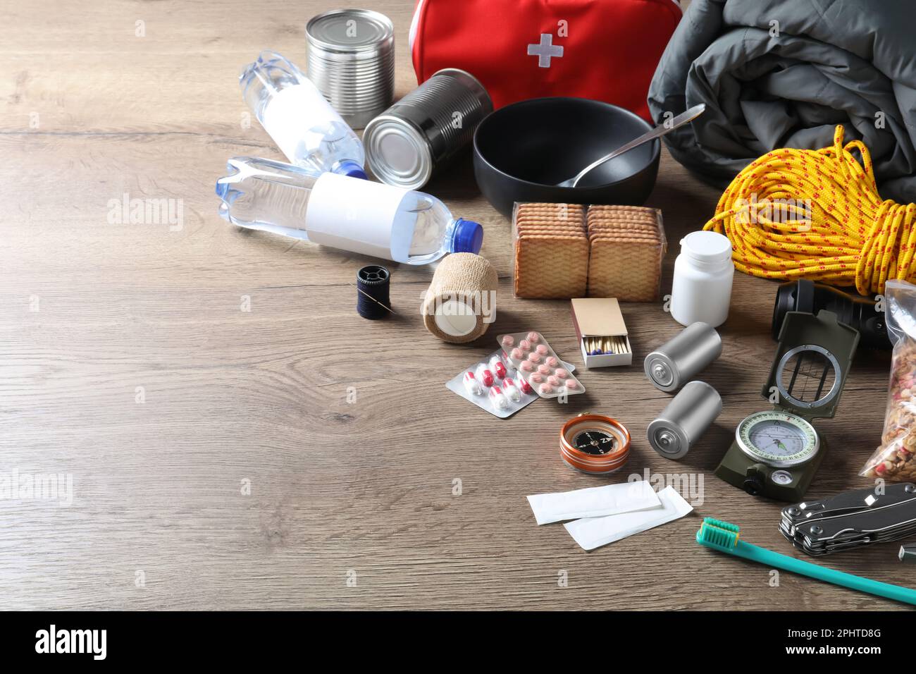 Earthquake supply kit on wooden table. Space for text Stock Photo - Alamy