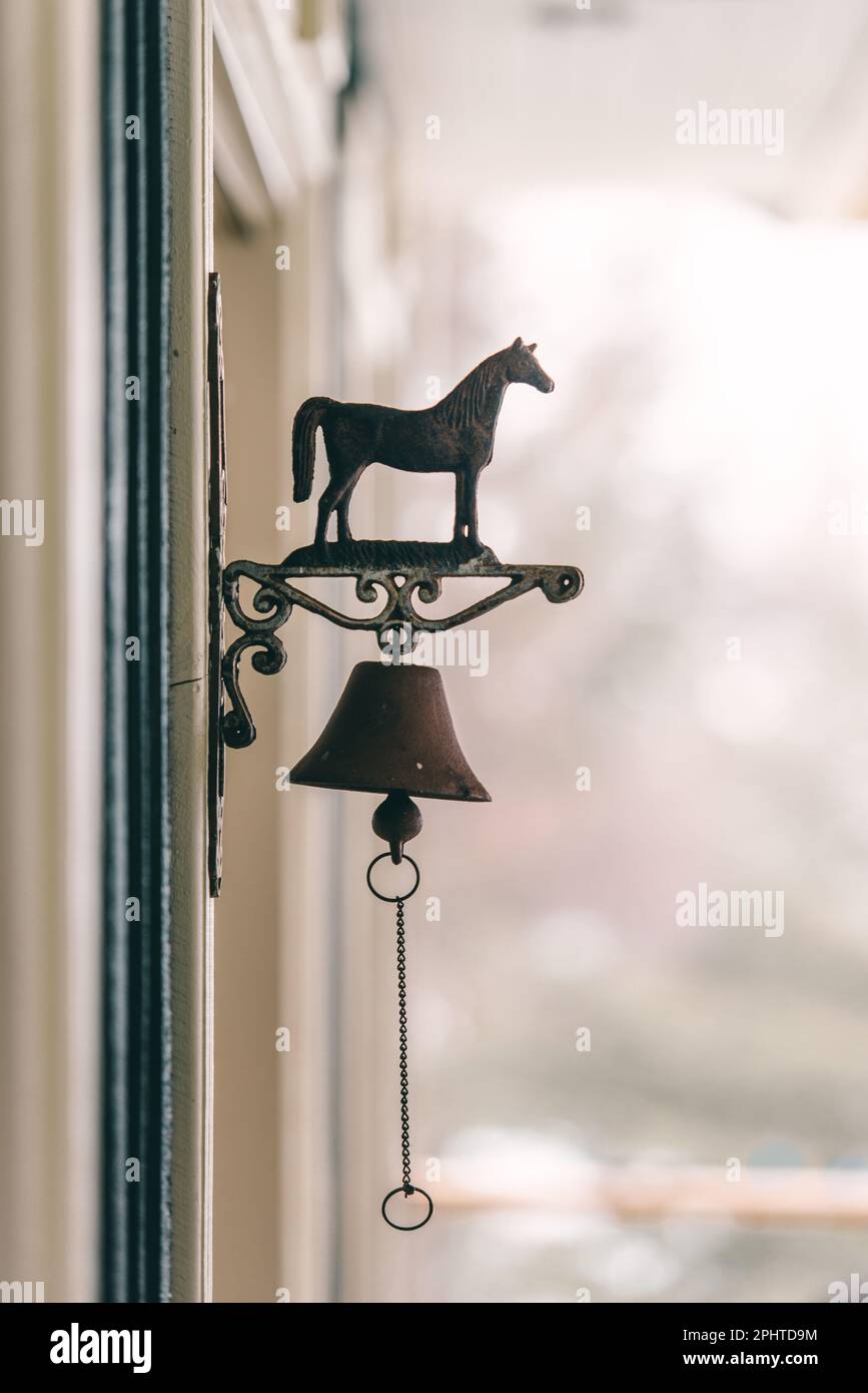 Horse bell hanging on the window. Vintage style. Selective focus Stock ...