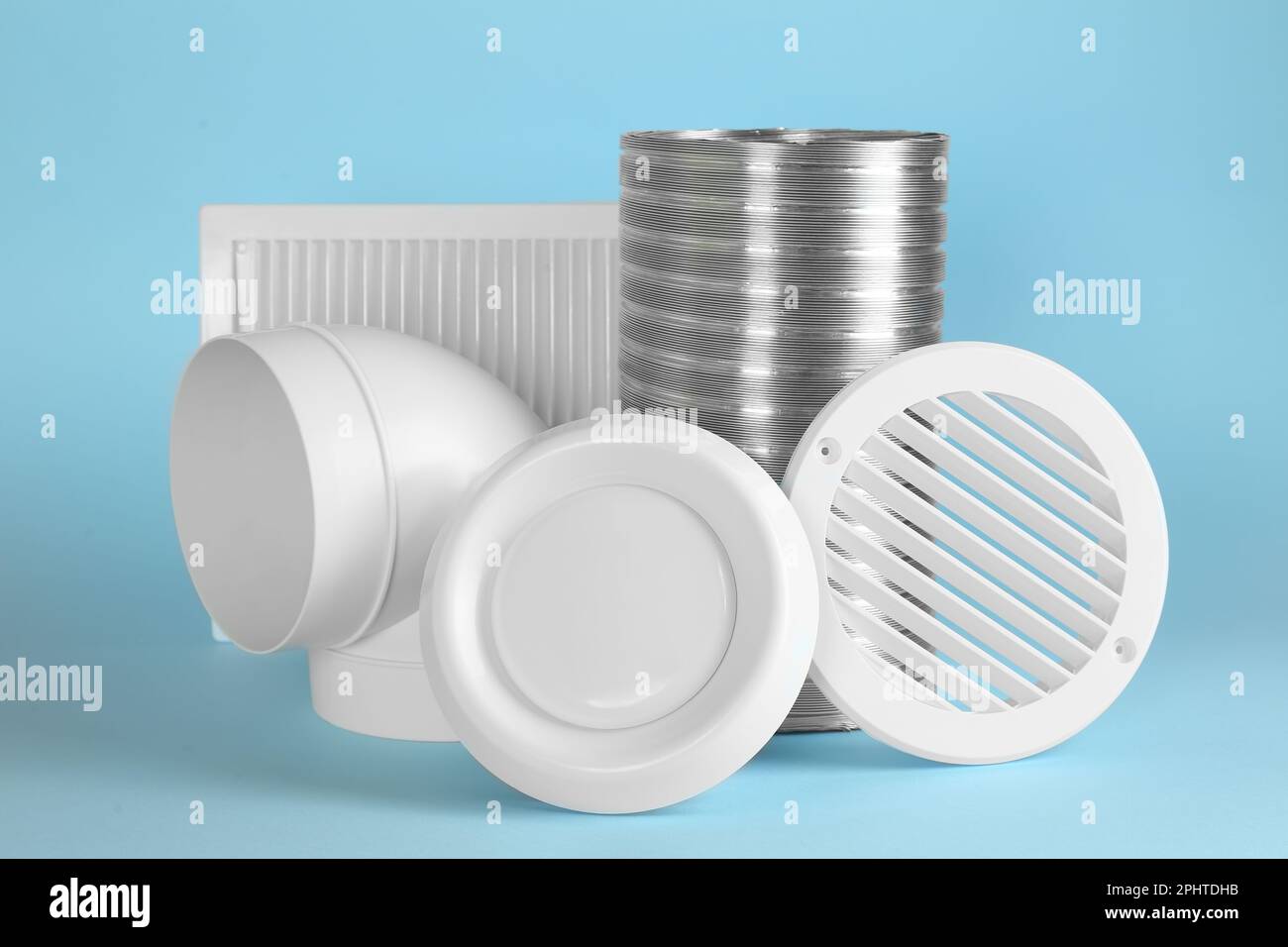 Parts of home ventilation system on light blue background Stock Photo ...