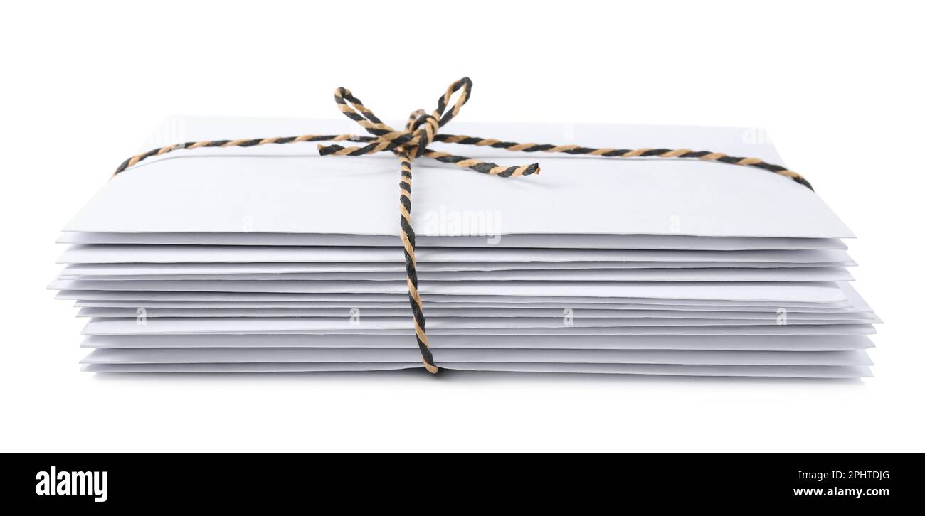 Stack of letters wrapped with rope on white background Stock Photo - Alamy