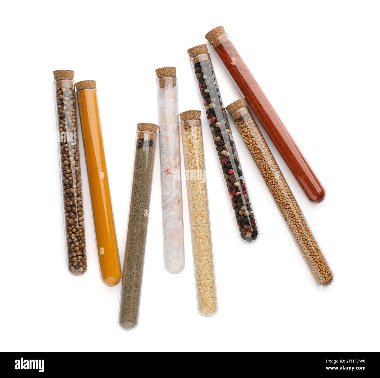 Glass tubes with different spices on white background, top view Stock ...