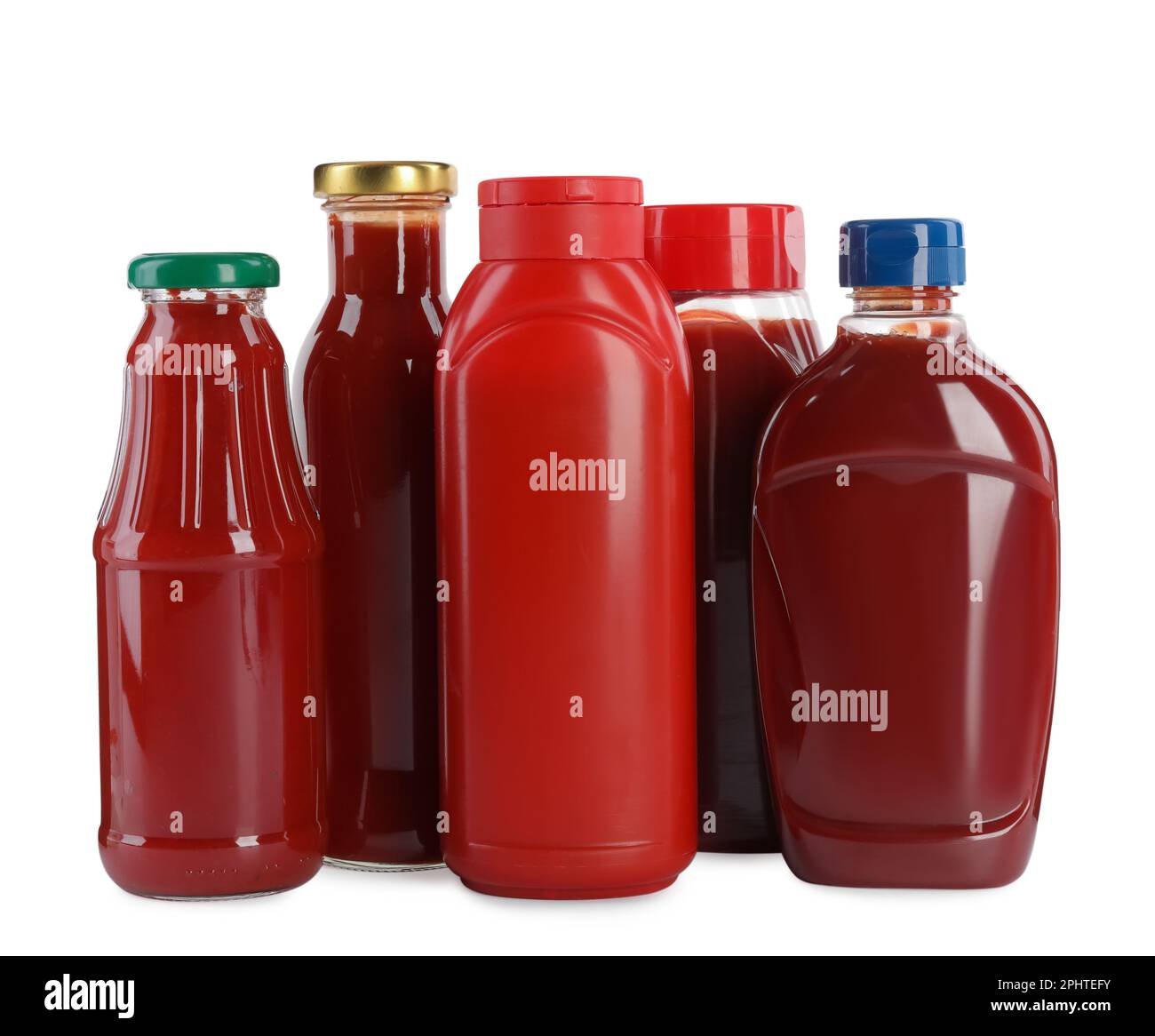 Different bottles of ketchup on white background Stock Photo - Alamy