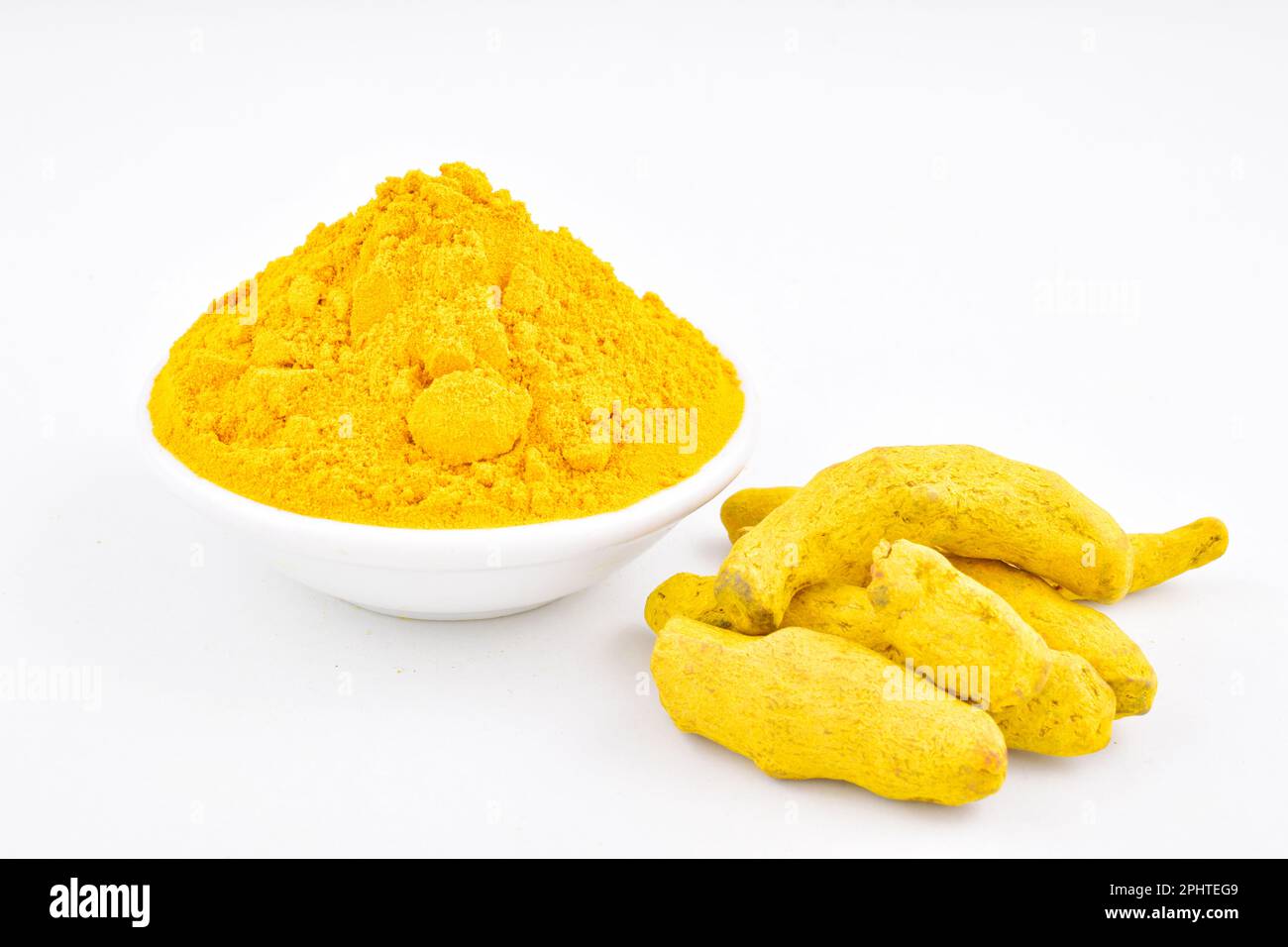 Turmeric powder in bowl on white background, indian spice haladi Stock ...