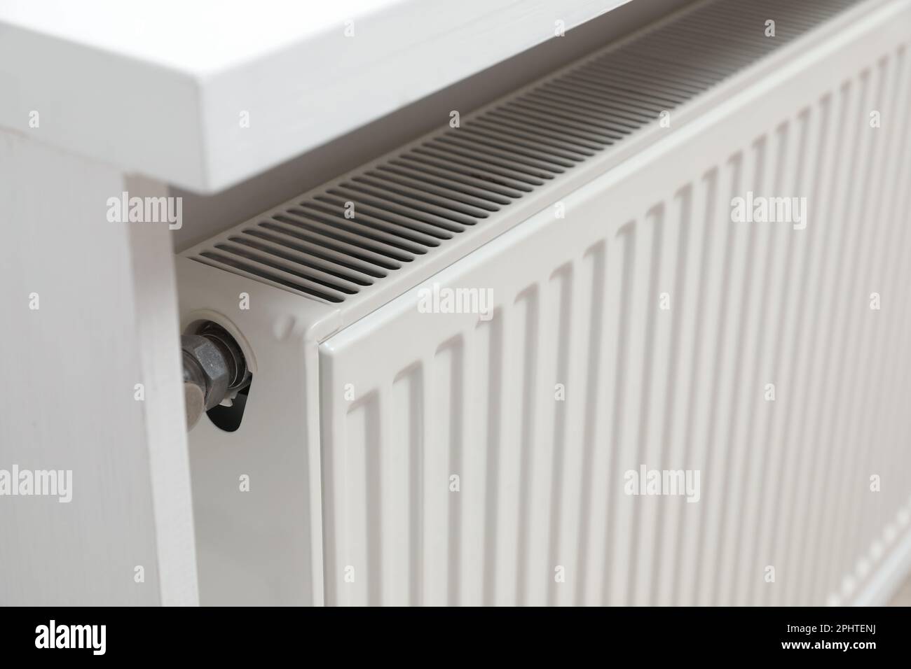 Closeup view of modern radiator. Central heating system Stock Photo - Alamy