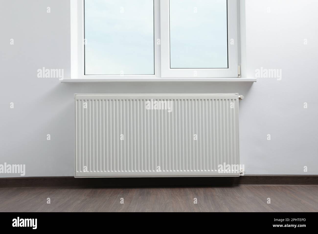 Modern radiator at home. Central heating system Stock Photo - Alamy