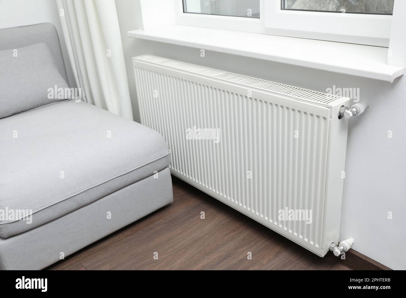 Modern radiator at home. Central heating system Stock Photo - Alamy