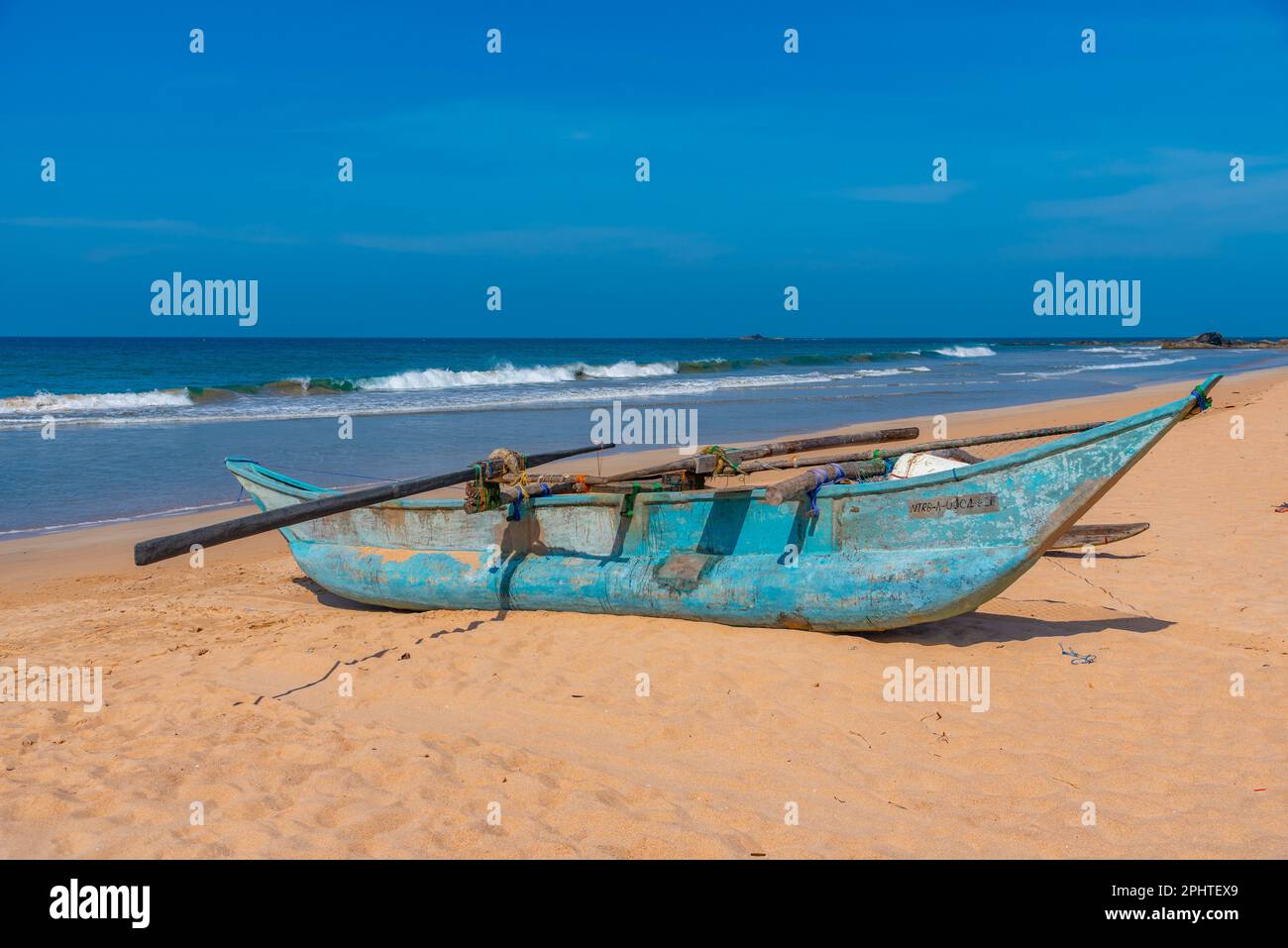 Fishing boat on a beach at Bentota, Sri Lanka Stock Photo - Alamy