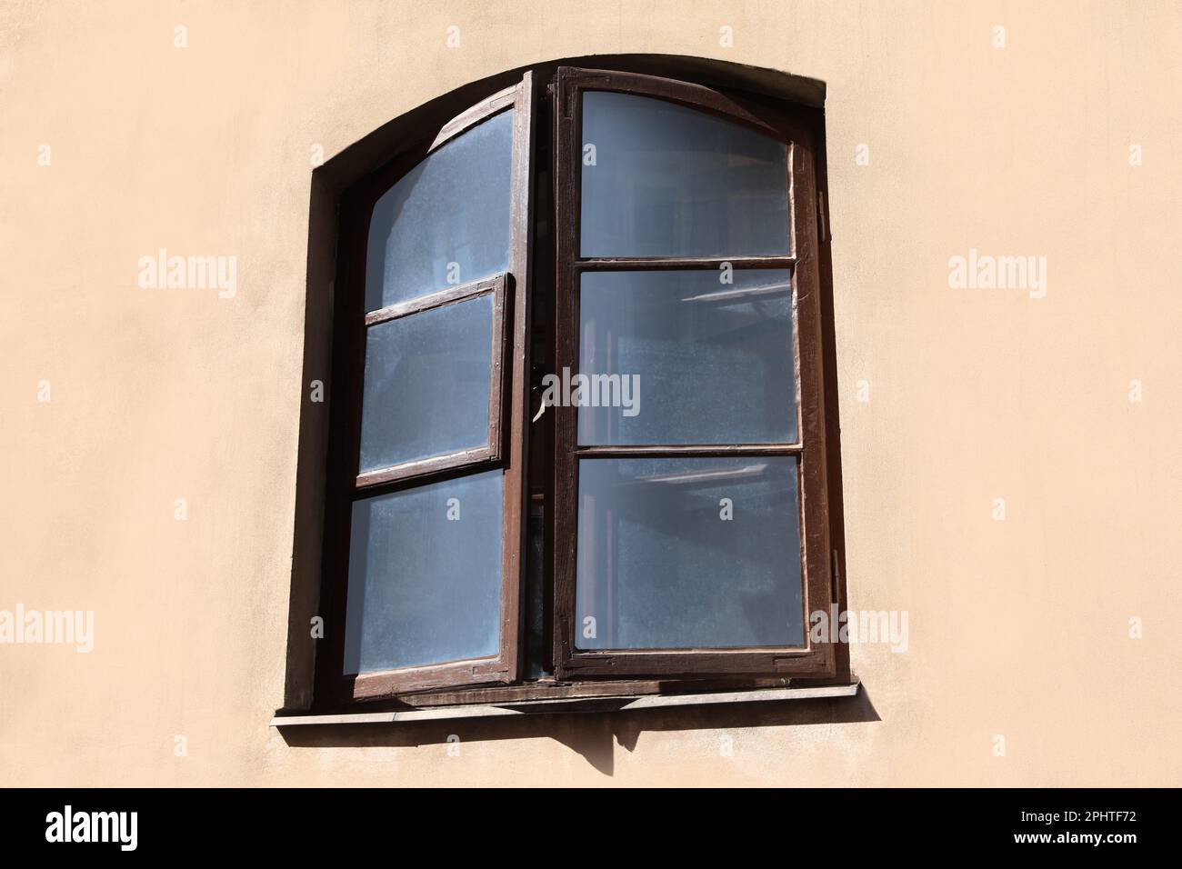 Old arched window in building, view from outdoors Stock Photo - Alamy