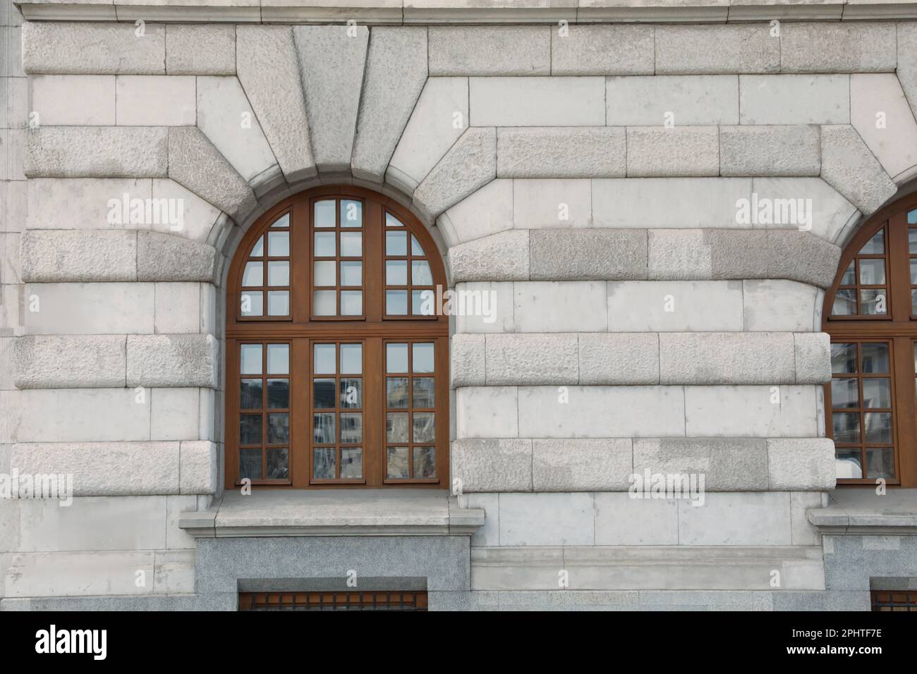 View of beautiful arched windows in building outdoors Stock Photo - Alamy
