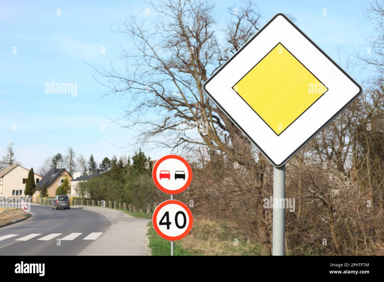 Different traffic signs on city street, space for text Stock Photo - Alamy