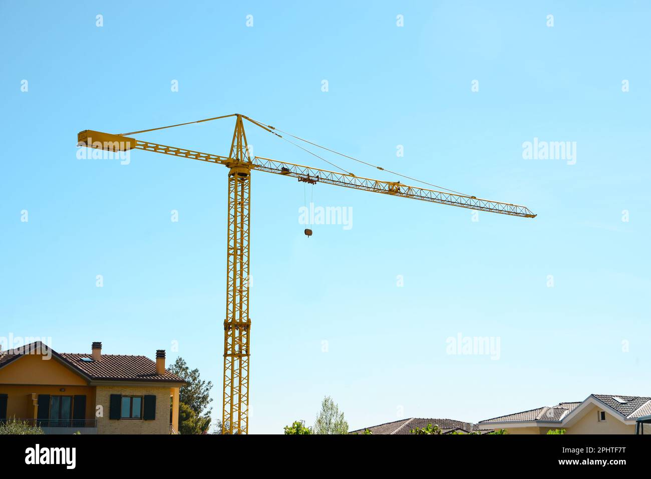 Modern construction crane outdoors on sunny day Stock Photo - Alamy